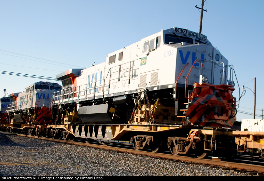 VLI BB40-9WM #6033 is one of 8 locomotives in this train heading east bound for the port of ...